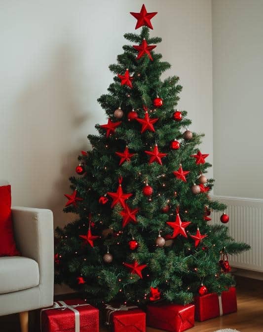 A Decorated Christmas Tree With Red And Silver Ornaments