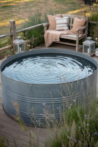40 Stock Tank Pool Ideas To Relax Outdoors in Style